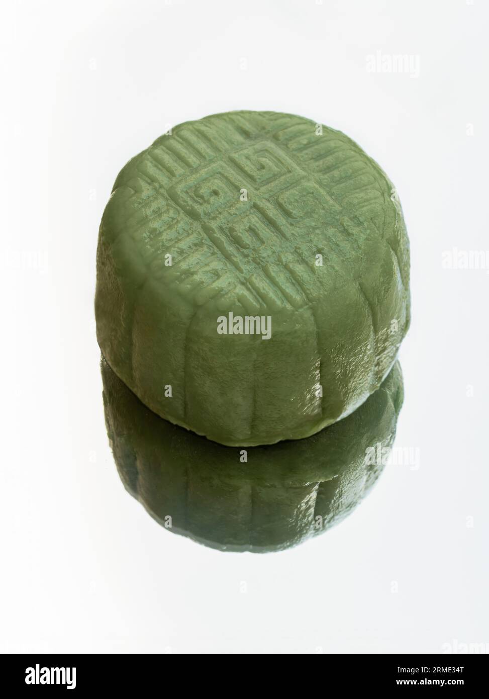 Delicious green mooncake is filled with taro, black sesame and golden ...