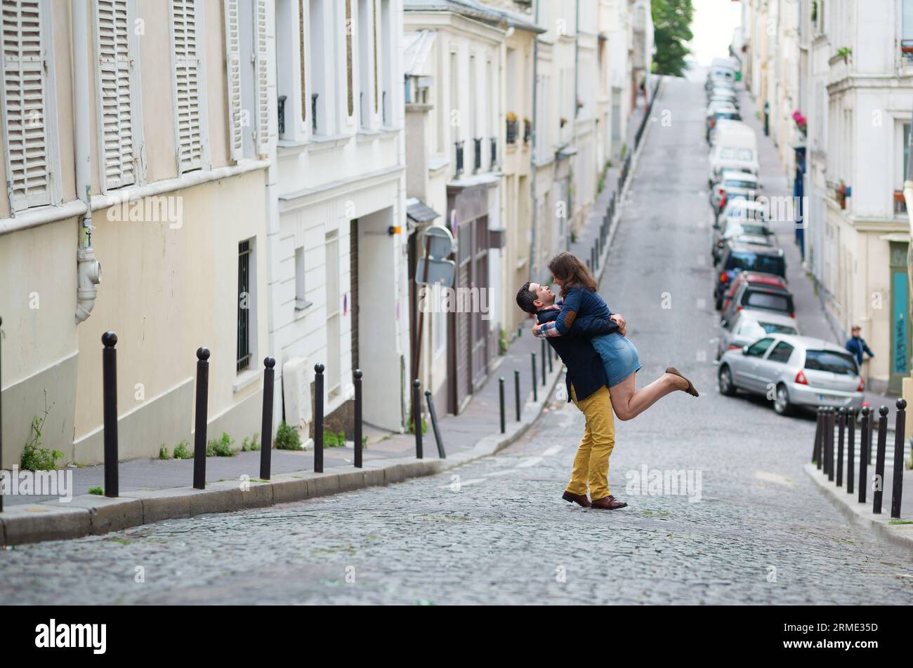 Happy romantic couple is hugging on Montmartre, girl is jumping Stock ...