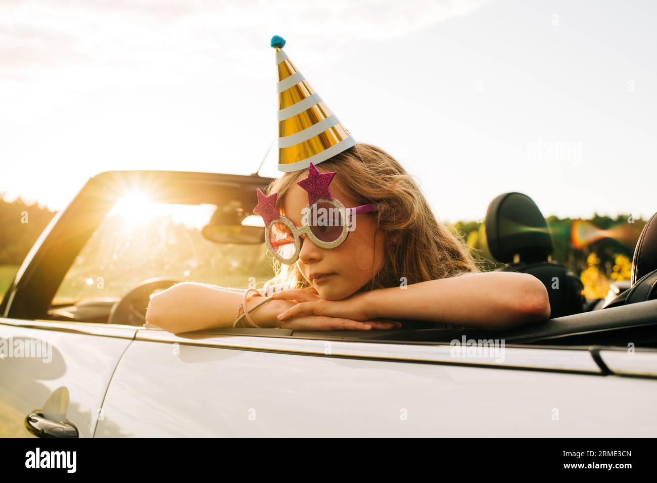 girl looking like she's tired of the party whilst waiting to go home ...
