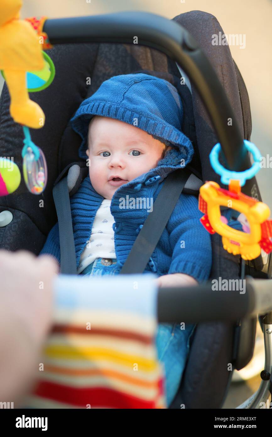 Adorable little baby boy in a stroller Stock Photo - Alamy