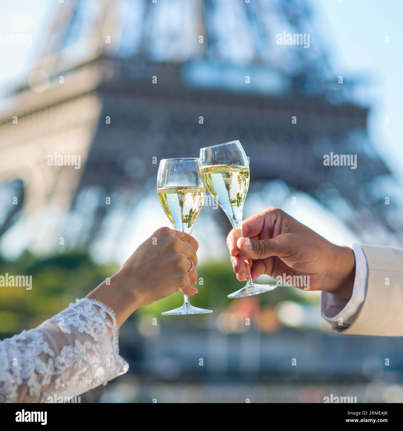 Just married couple drinking champagne to celebrate their marriage ...