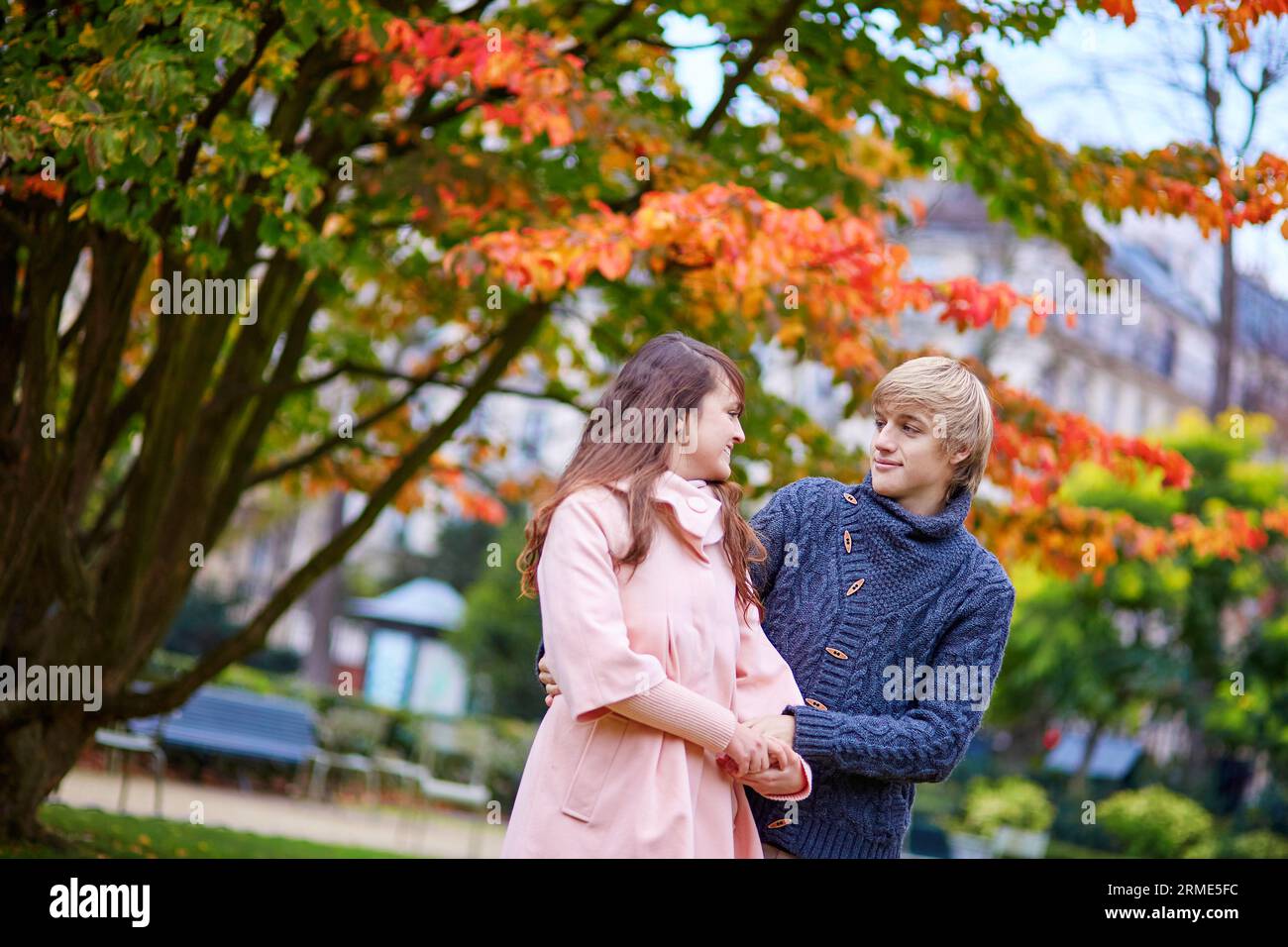 Young dating couple in the Luxembourg gardens of Paris on a bright fall ...