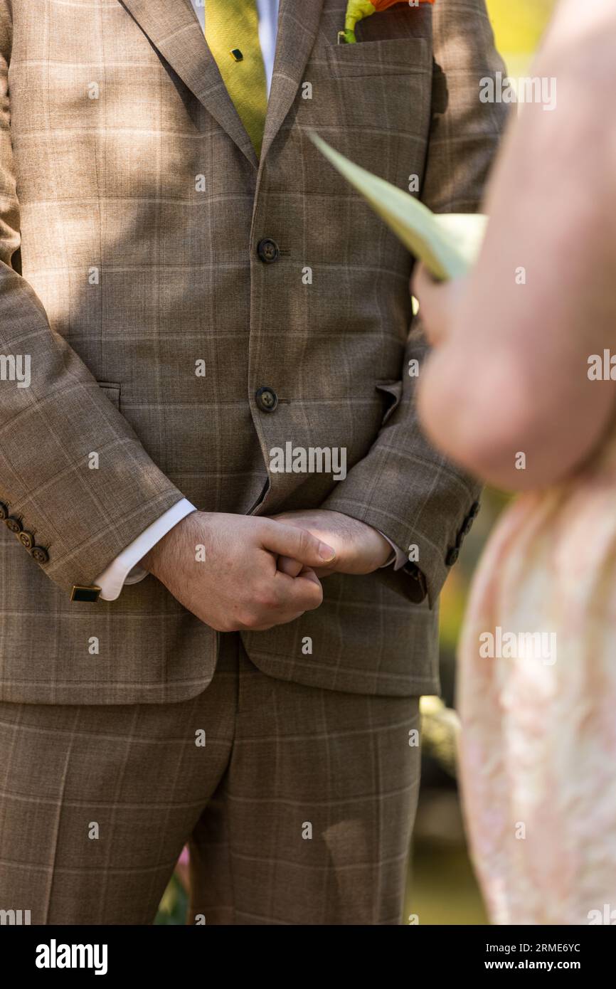 Groom's hands during emotional wedding vows at the altar Stock Photo ...