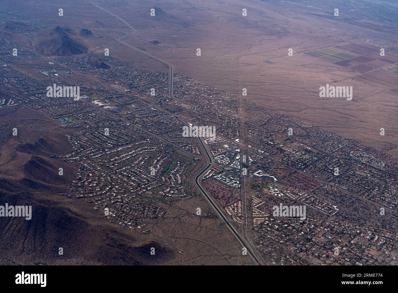 Overhead view looking down onto community in desert from high altitude ...