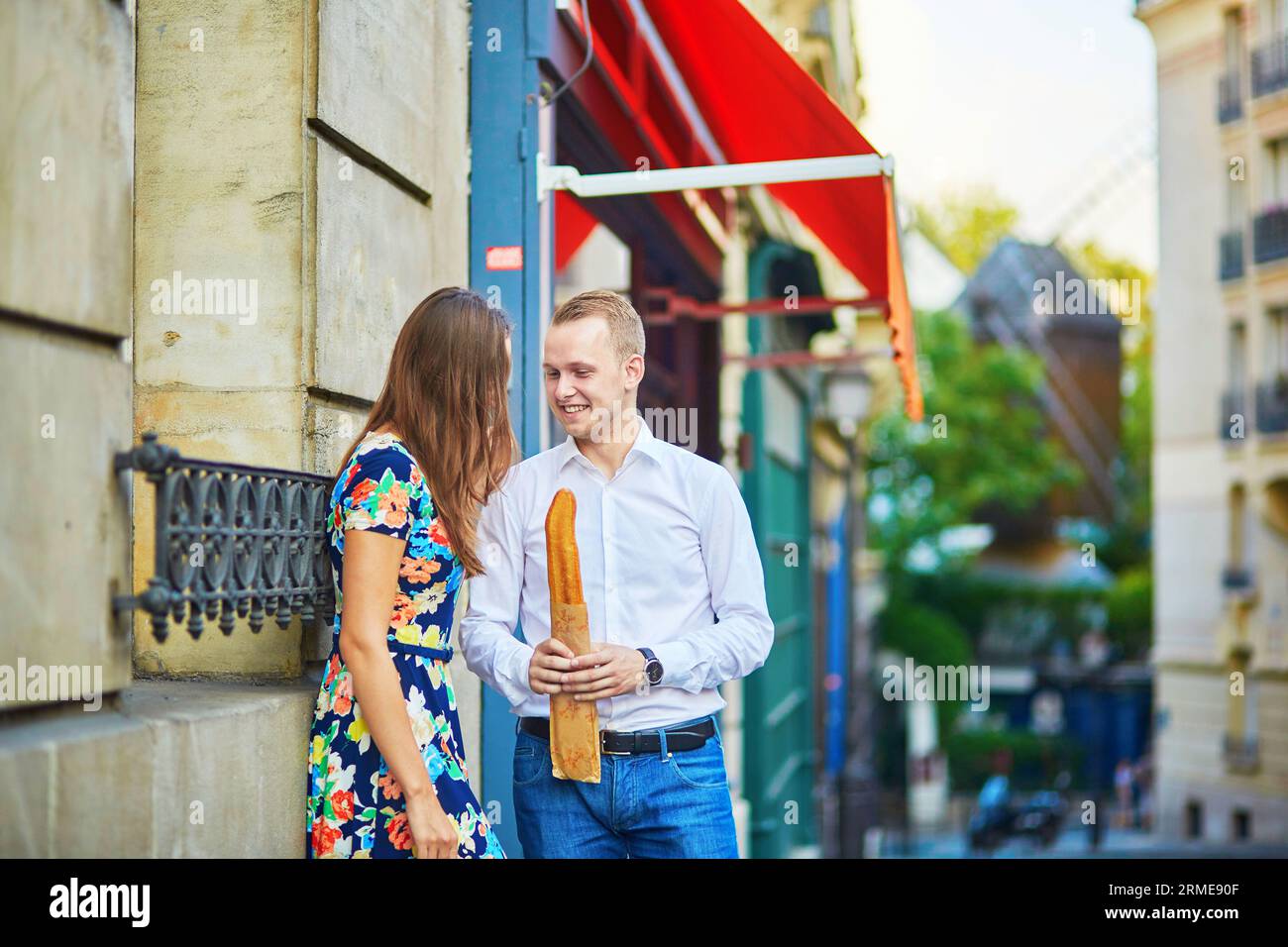Young romantic couple having a date on a street of Montmartre in Paris ...