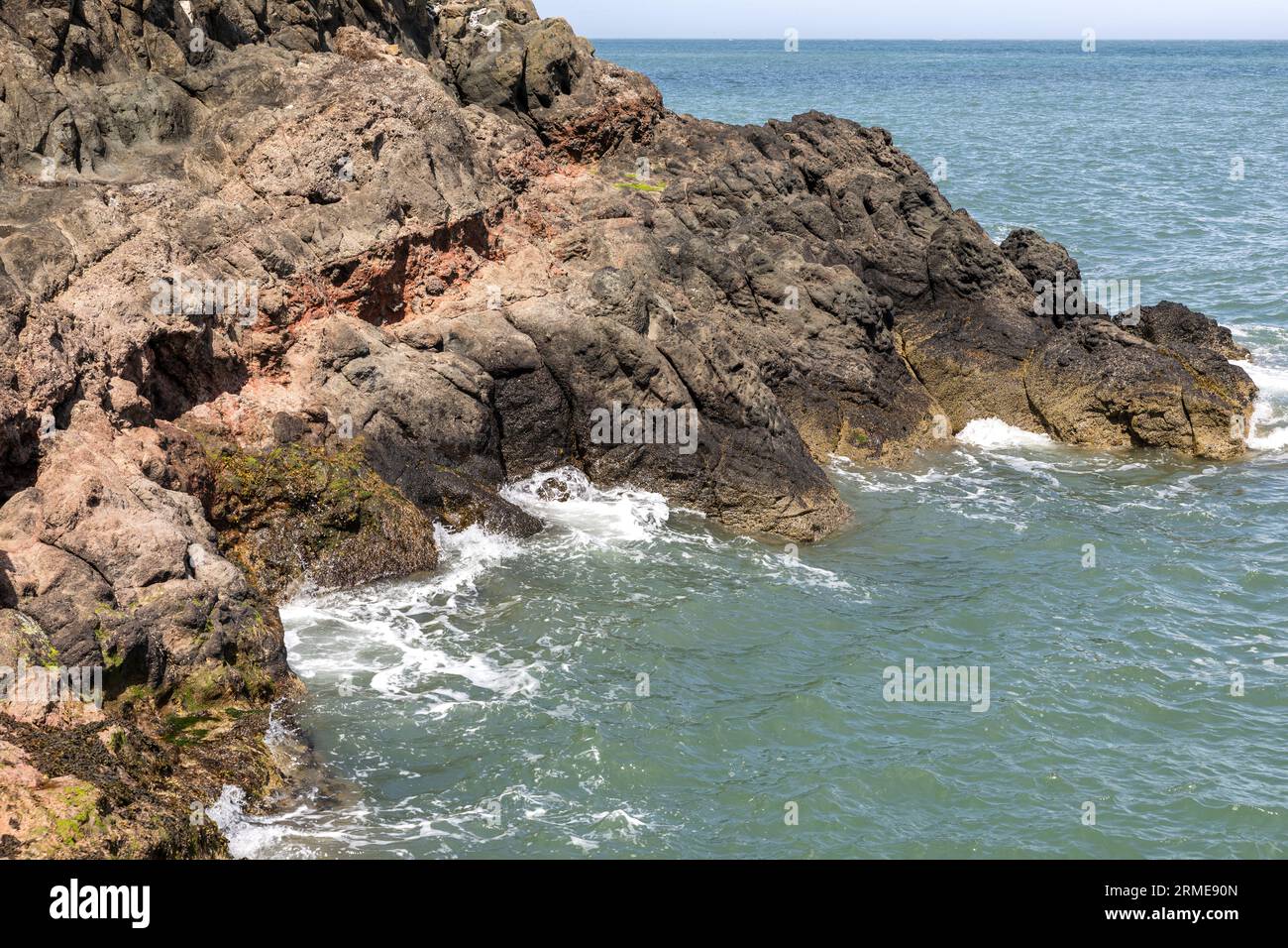 Red bands of laterite rock, Iron deposists from burnt vegetation ...