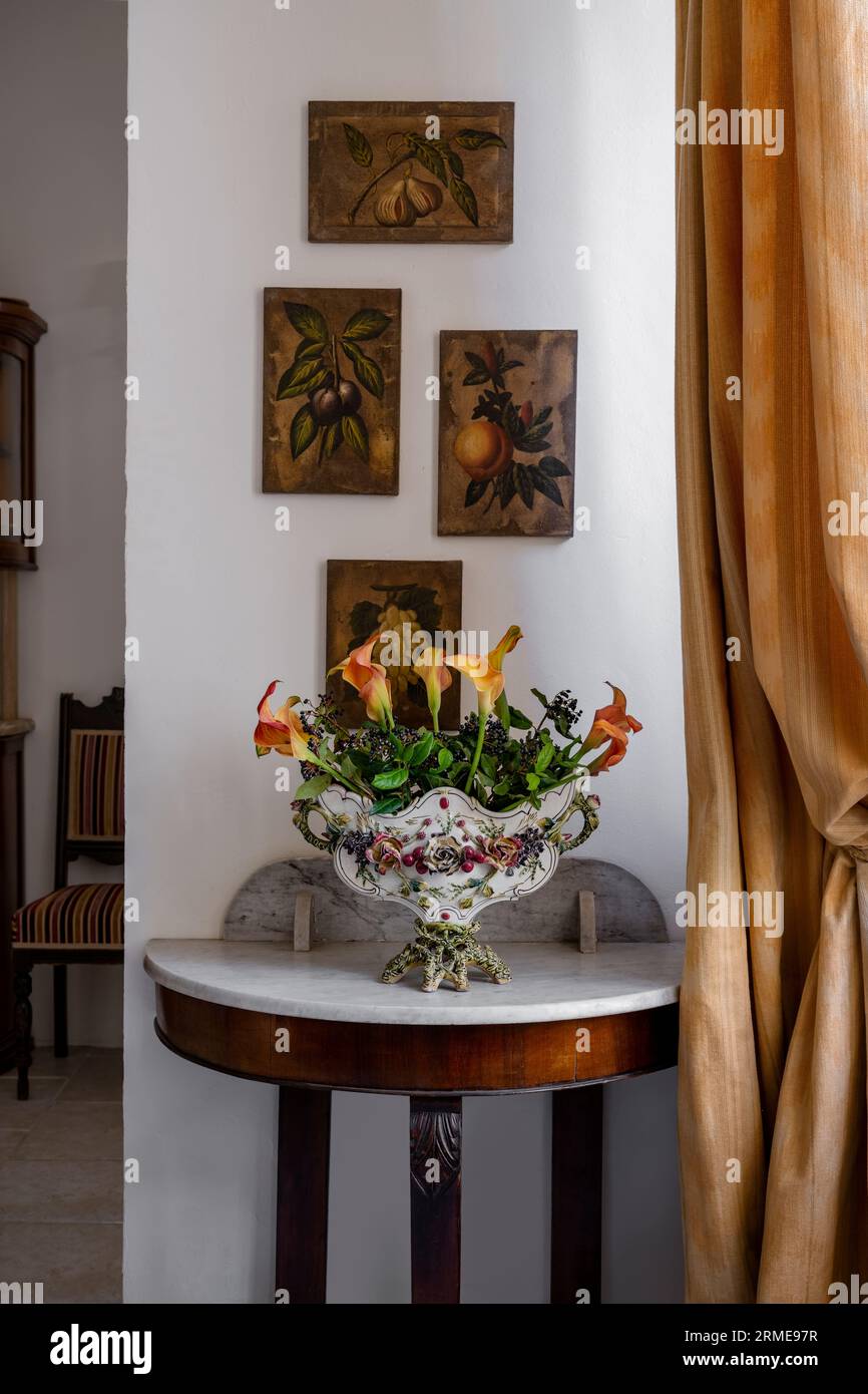 Lily arrangement on demi-lune table in Cotignac manor house, Var ...