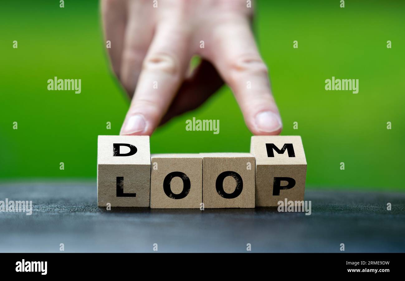 Wooden cubes form the expression 'doom loop'. Symbol for a climate doom ...