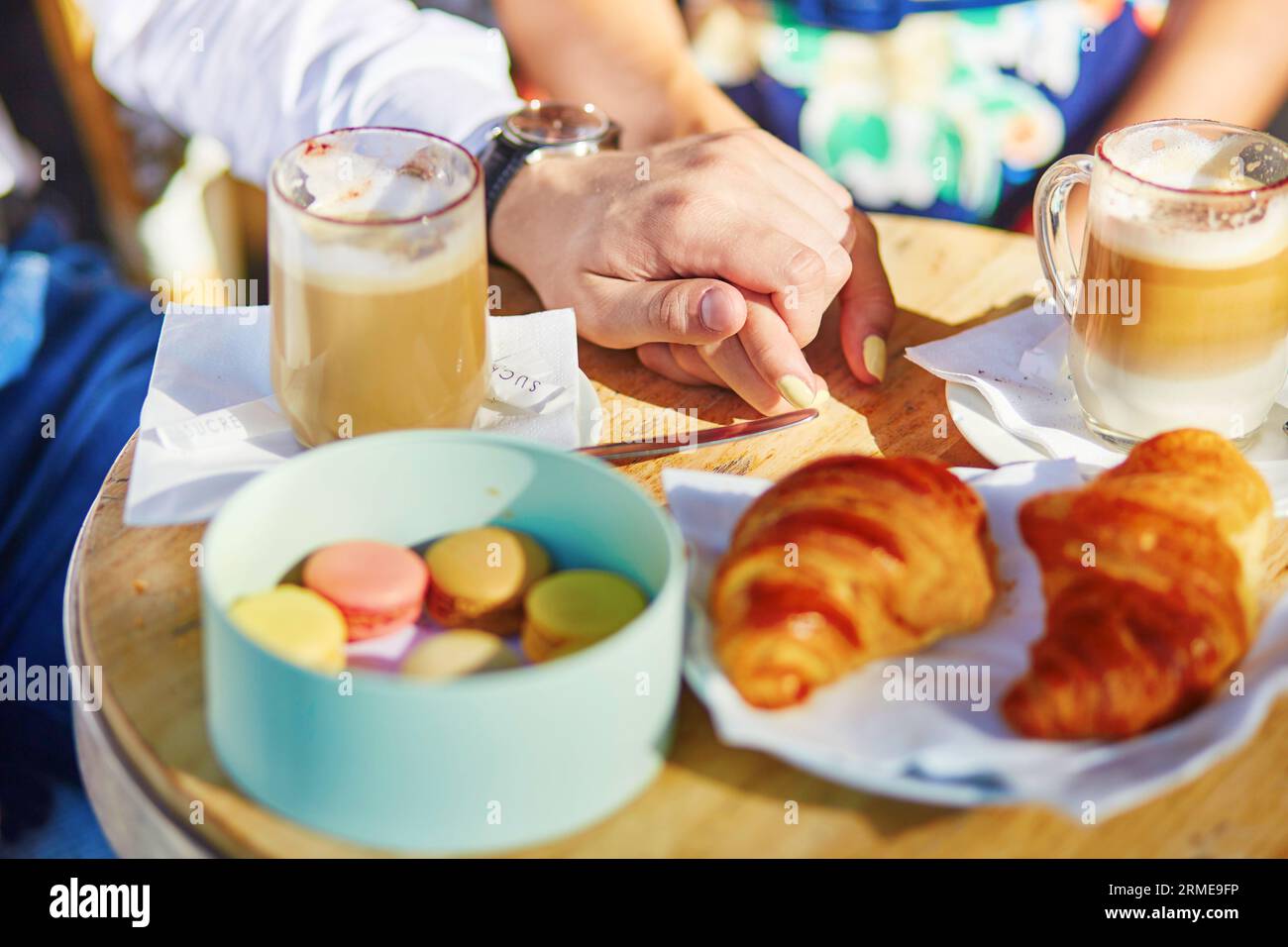 traditional French croissants and macaroons in a cozy outdoor cafe in ...