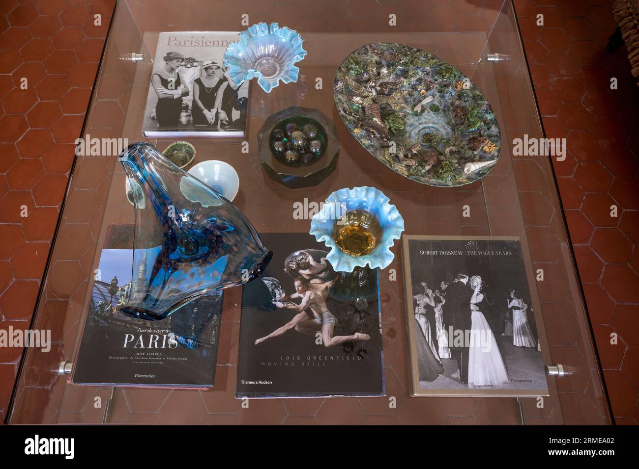 Collectors items under glass in Cotignac. Var, France Stock Photo - Alamy