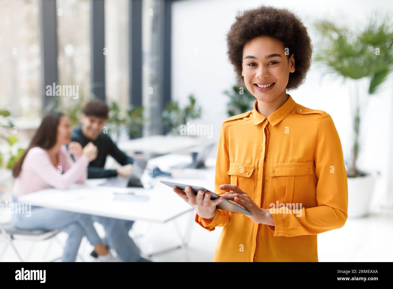 App for e-learning. Positive african american lady student using ...