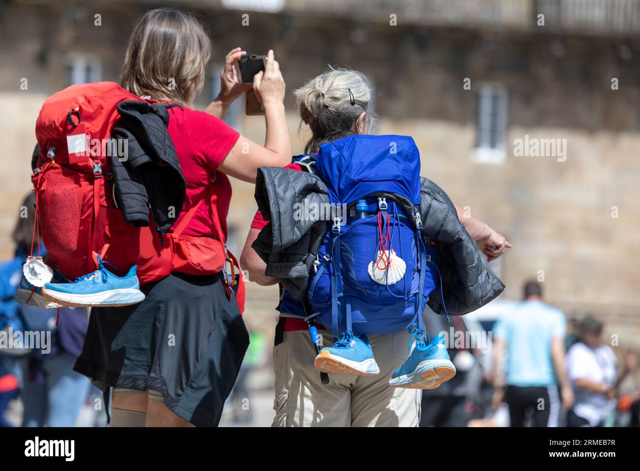 Pilgrims on the Camino de Santiago arrive at the Plaza del Obradoiro ...