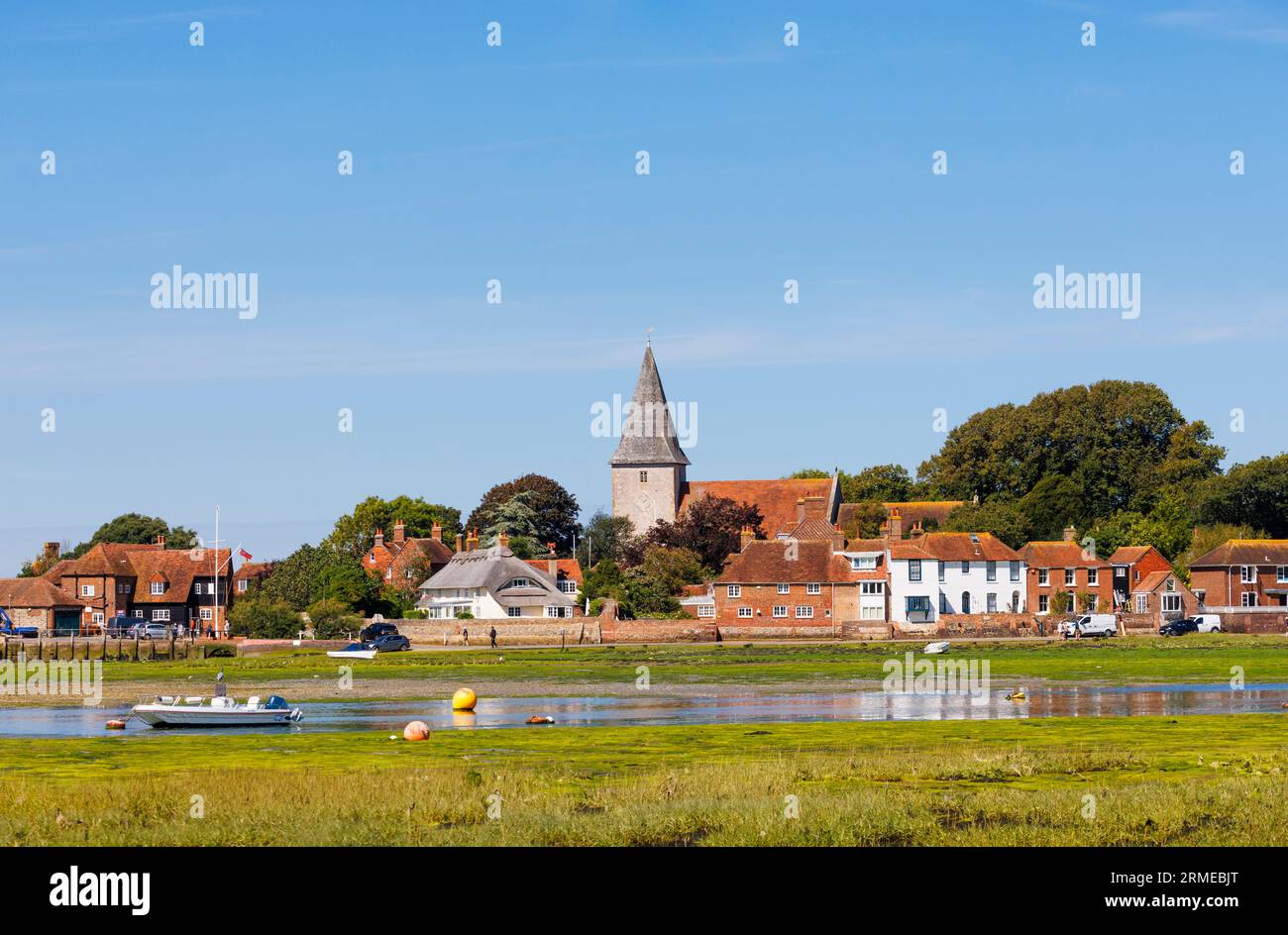 Holy Trinity Church and the waterfront at historic Bosham, a coastal ...