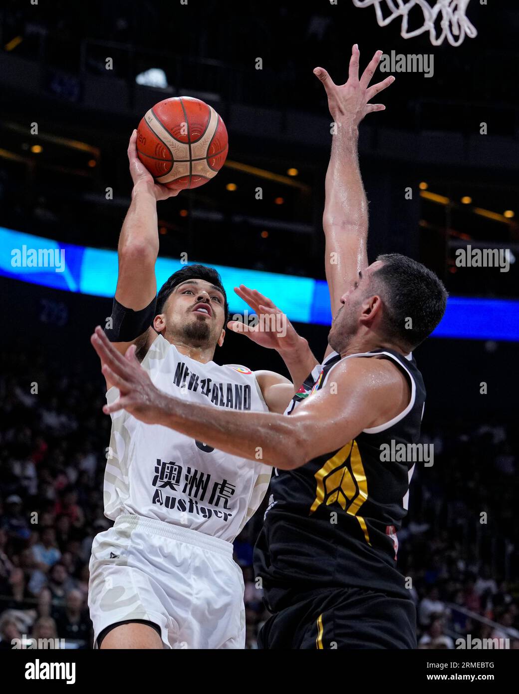 New Zealand guard Shea Ili (5) shoots over Jordan center Ahmad Dwairi ...
