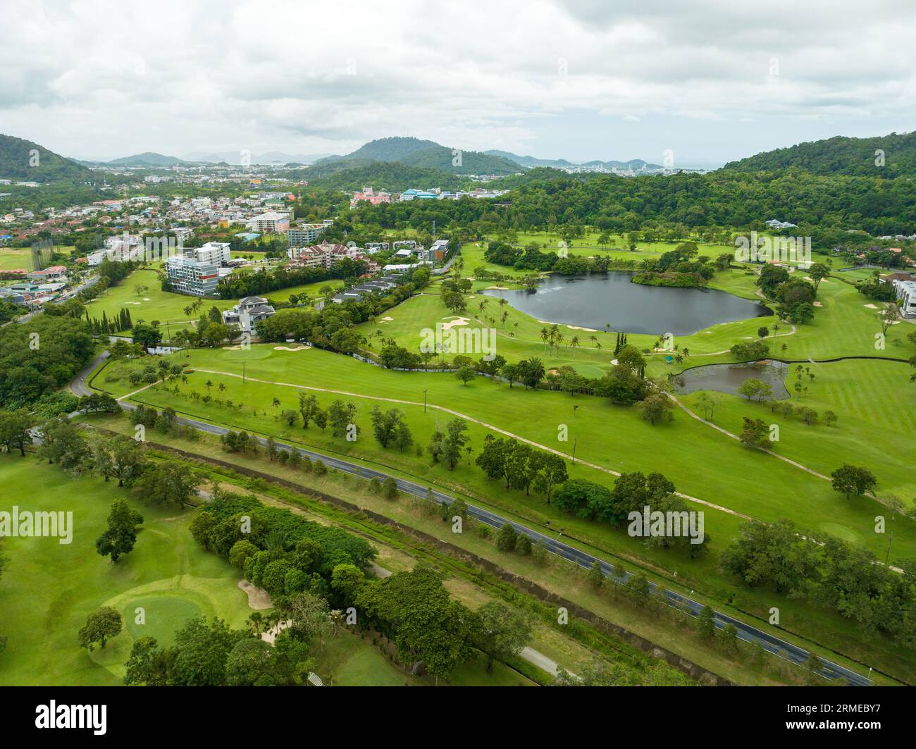 Aerial view drone shot of beautiful green golf field fairway and ...