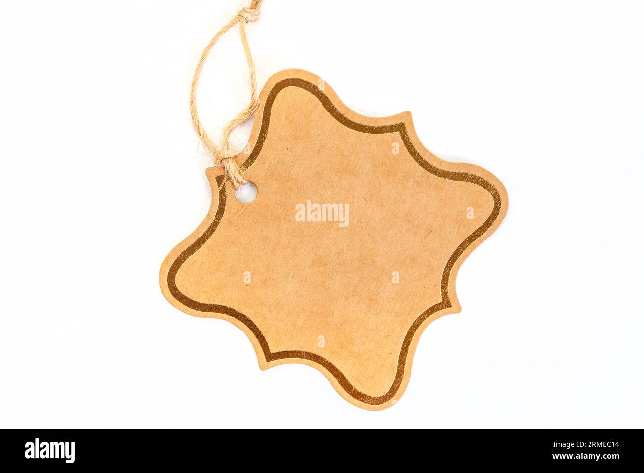 Blank cardboard gift tag isolated on plain white Stock Photo - Alamy