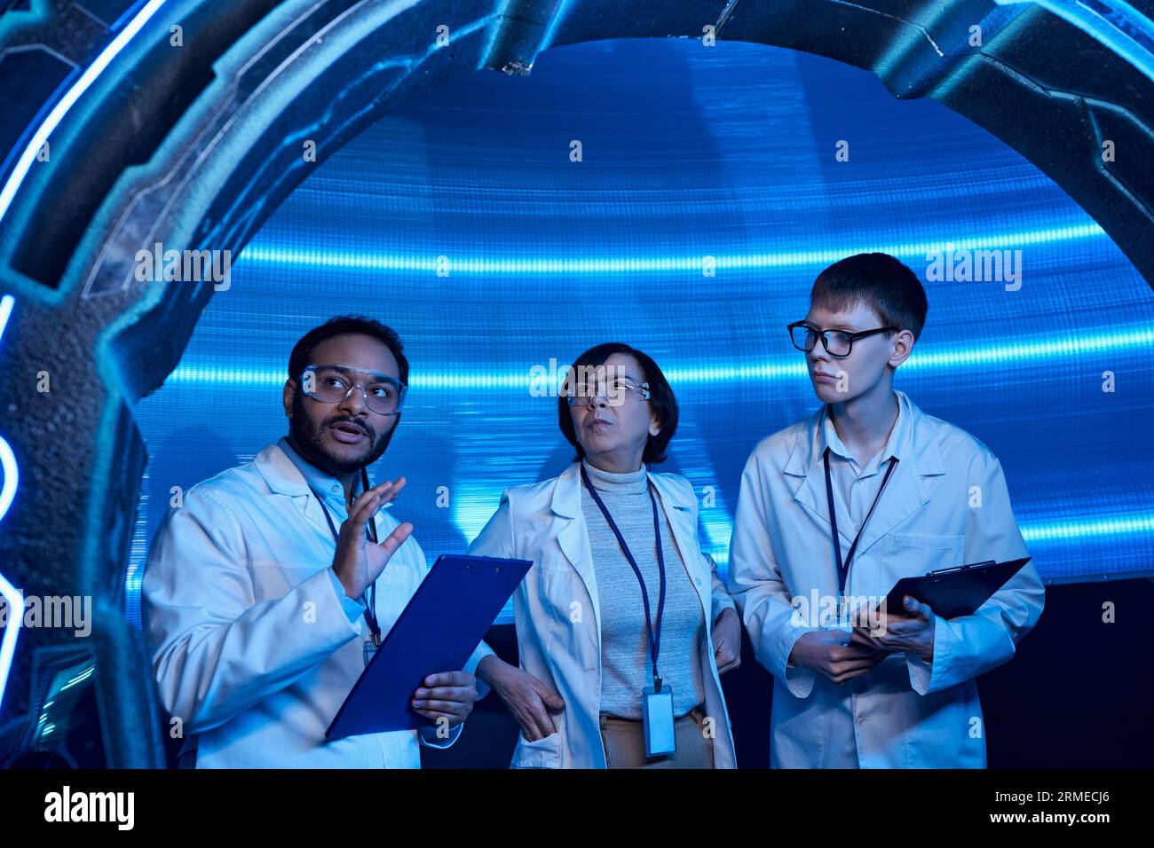 futuristic invention, indian scientist talking near colleagues and new ...