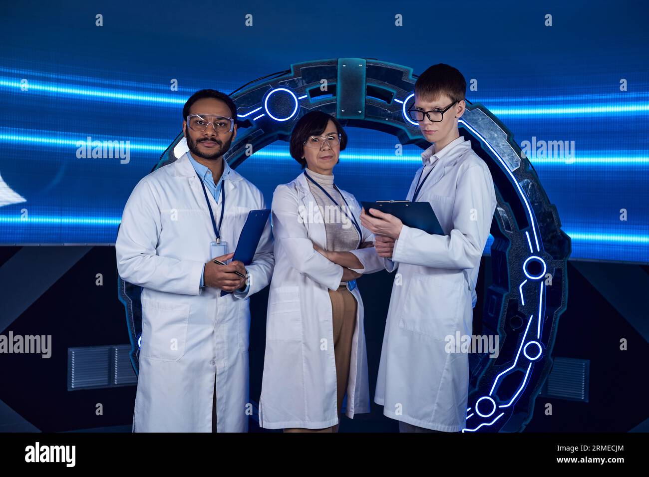 future-oriented multiethnic scientists looking at camera near ...