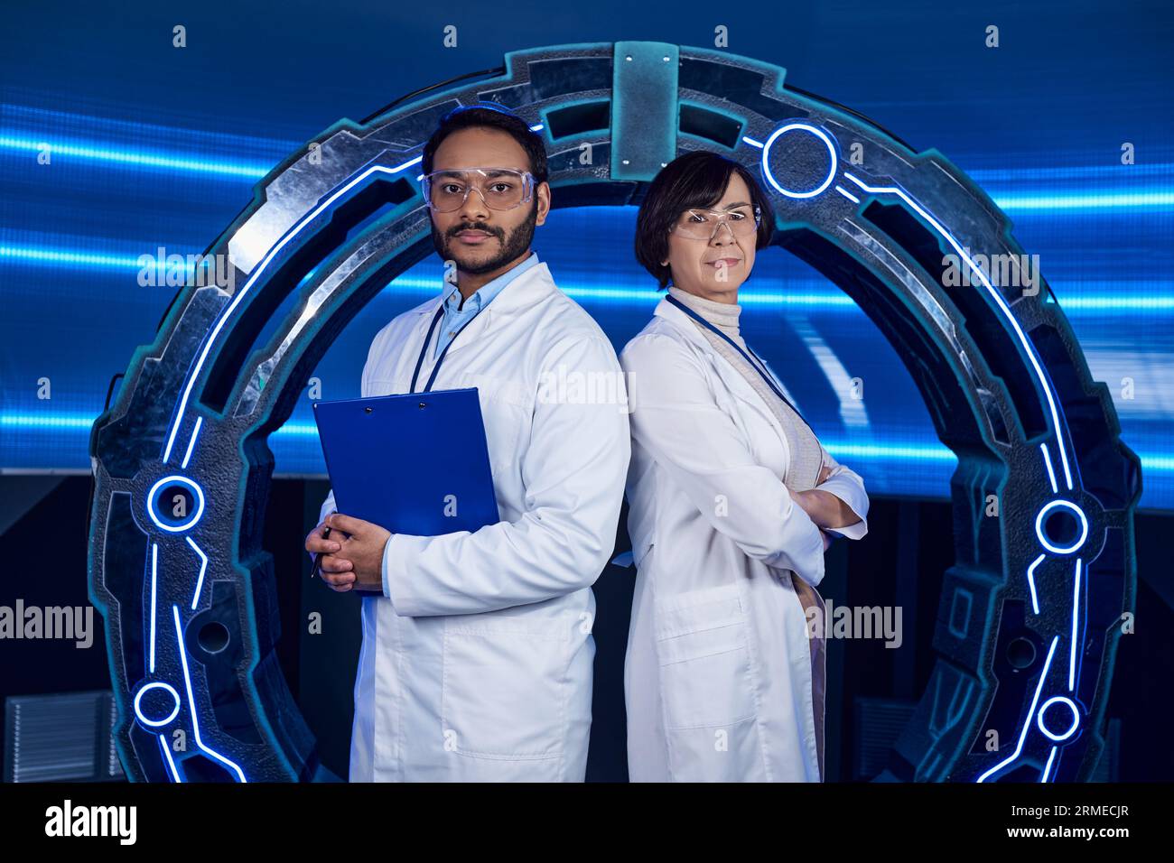 forward-thinking multiethnic scientists looking at camera back to back ...