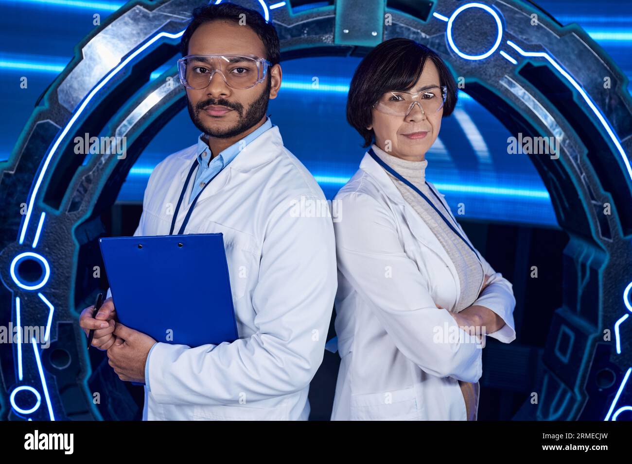 forward-thinking multiethnic scientists standing looking at camera back ...