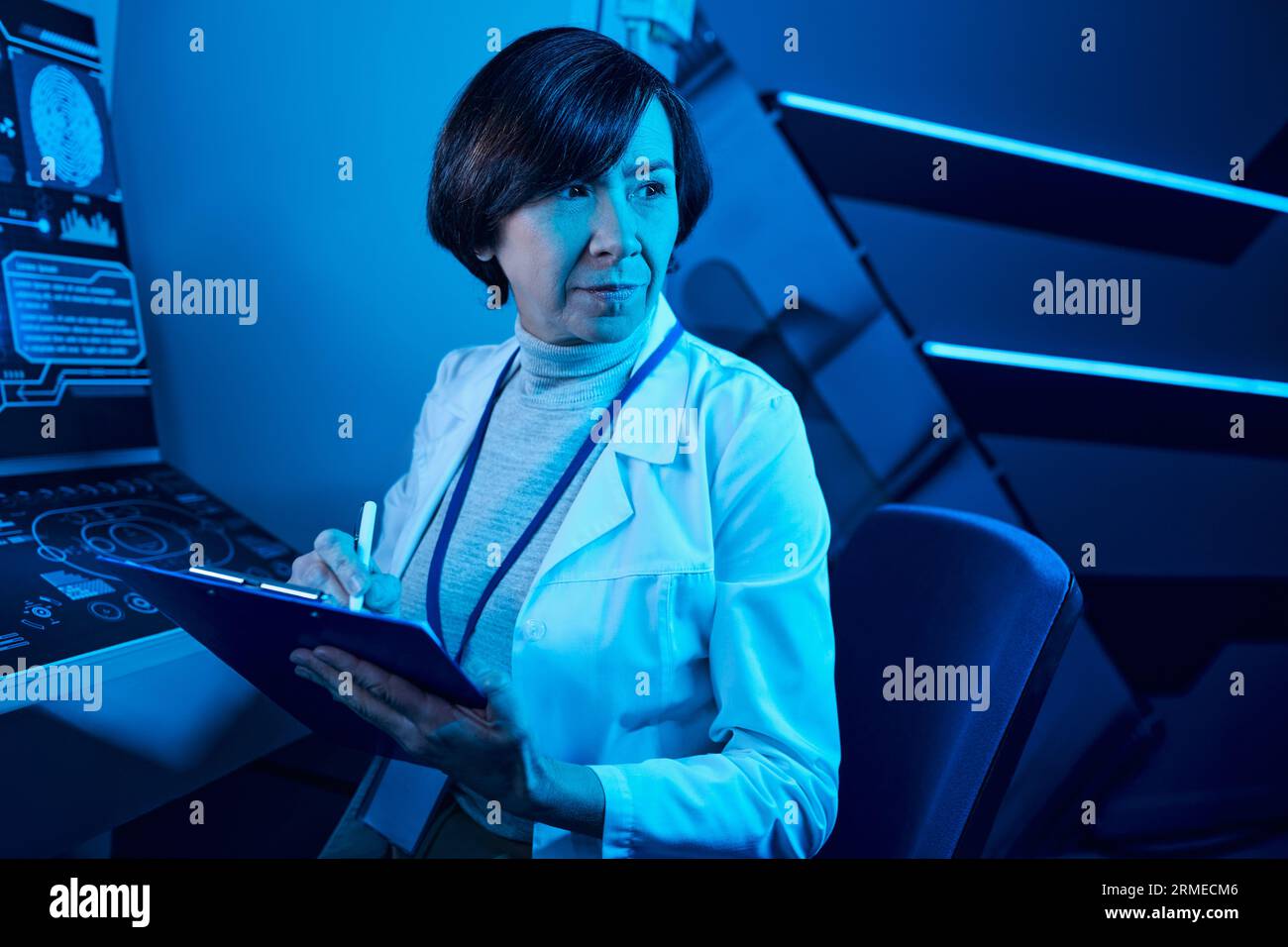 Woman Scientist Records Data and Contemplates in Future Science Center ...