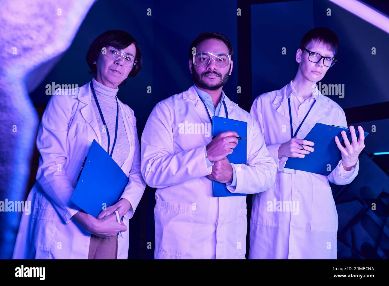 Futuristic Observation: Three Scientists Examine Newly Created Device ...