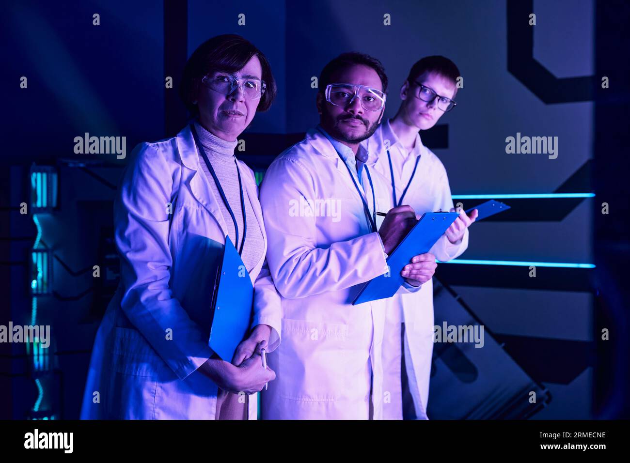 Futuristic Focus: Three Scientists Engage in Headshot Analysis Within ...