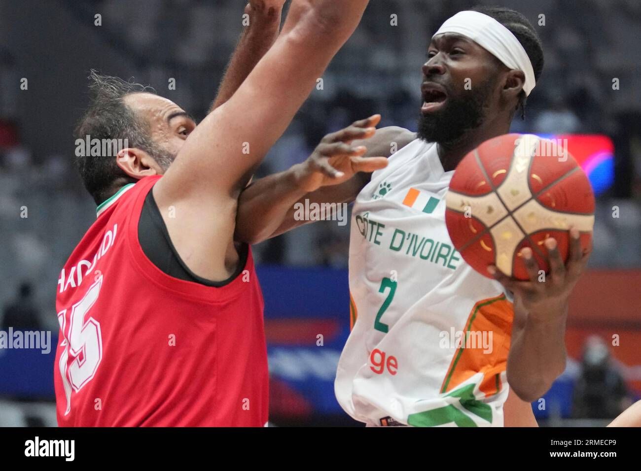 Cote D'Ivoire guard Bazoumana Kone (2) drives past Iran center Hamed ...