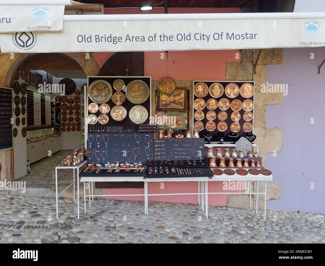 Copper ware shop on cobbled street in the old town unesco site in the ...