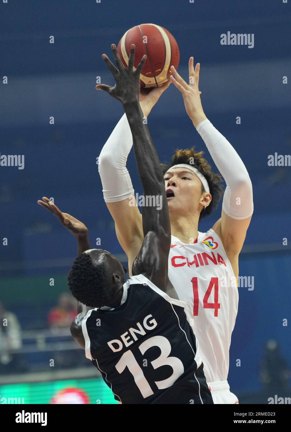 Manila, Philippines. 28th Aug, 2023. Wang Zhelin (rear) of China shoots during the Group B match ...