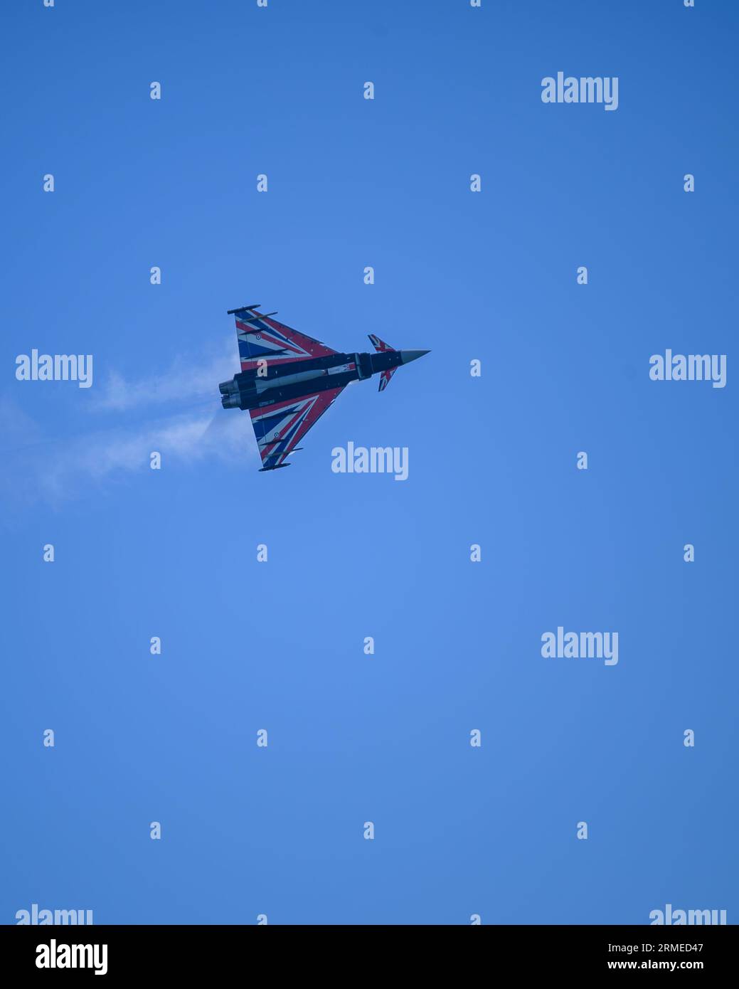 Underside of an Eurofighter Typhoon with vapour trail at Eastbourne ...
