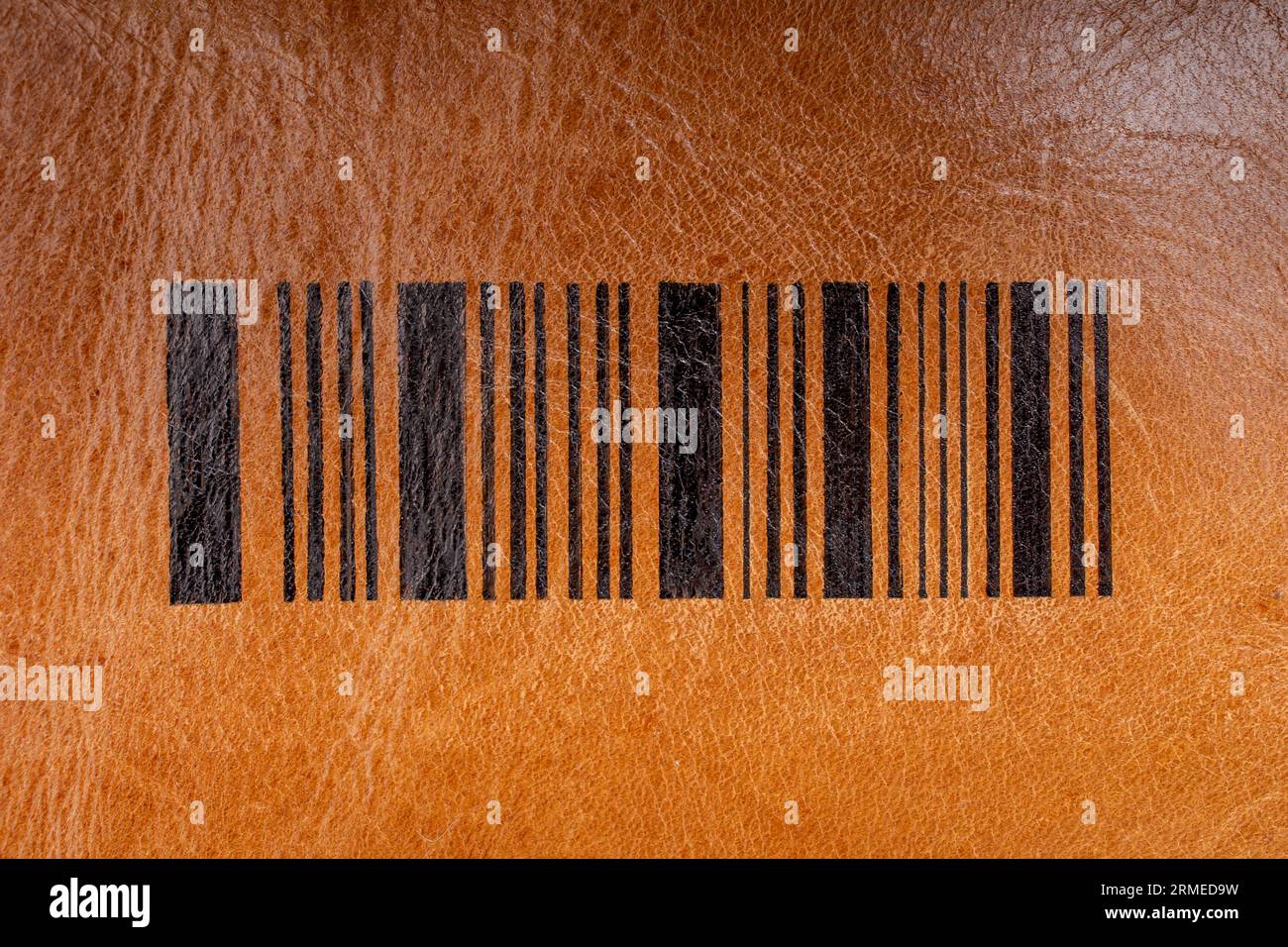 Fake barcode linesdrawn with black ink on genuine leather texture ...