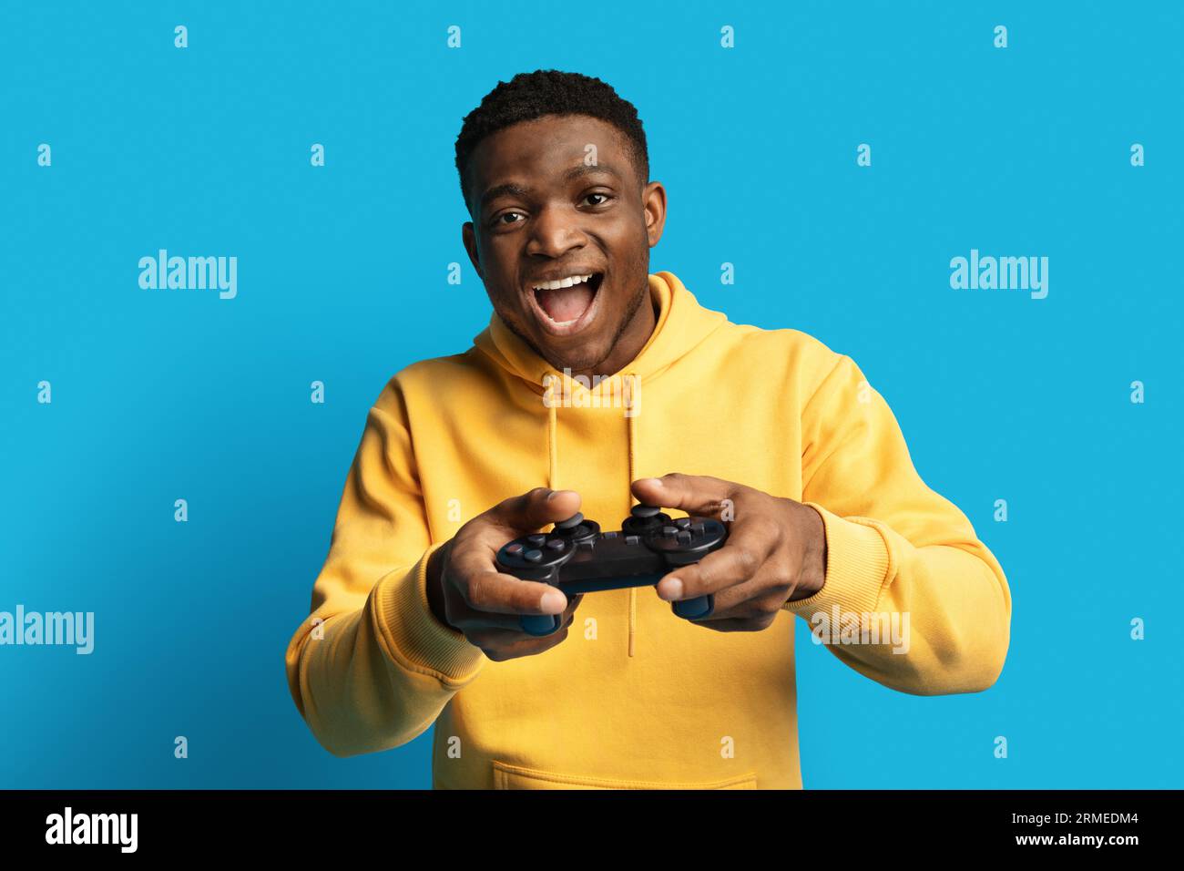 Happy african american man playing video games with joystick Stock ...