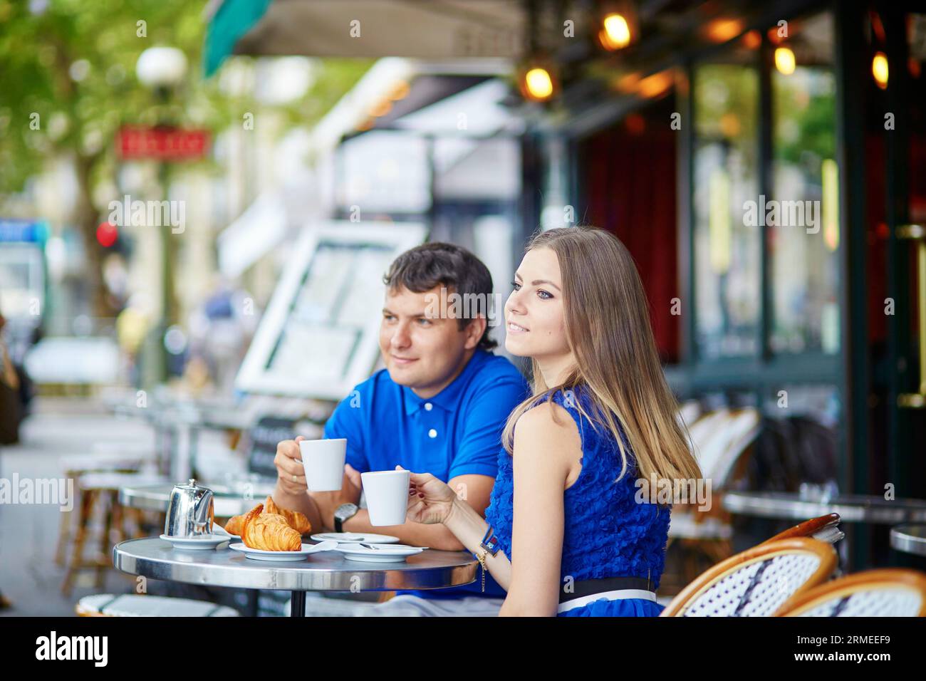 Romantic dating couple in traditional Parisian cafe, drinking coffee ...