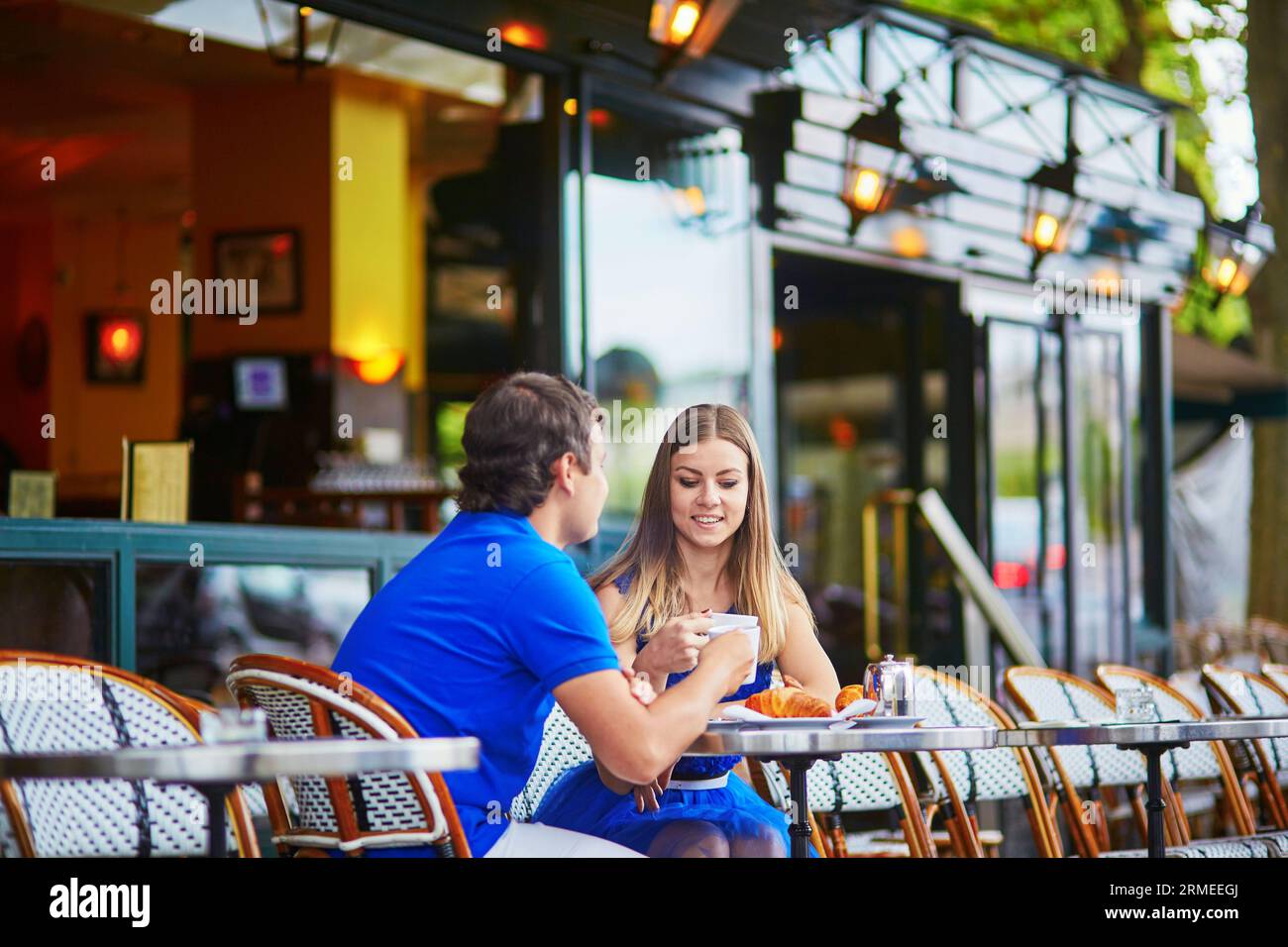 Romantic dating couple in traditional Parisian cafe, drinking coffee ...