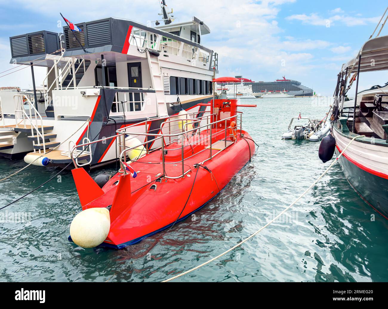 Submarine and yachts in the port Stock Photo - Alamy