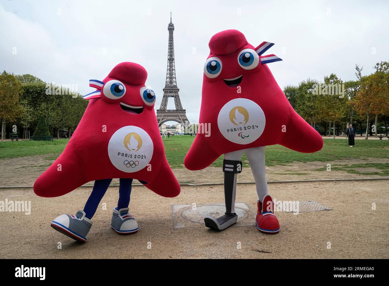The mascots of the Paris 2024 Olympic, left, and Paralympic Games pose ...