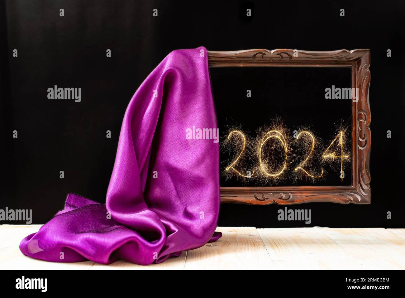 silky fabric unveiling an levitating wooden frame, with 2024 new year ...