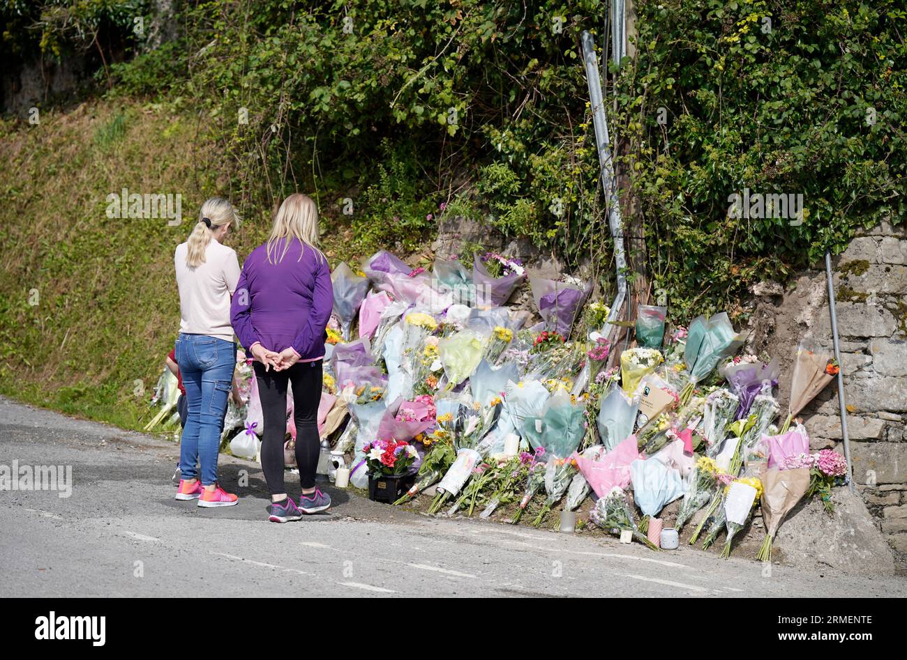 People view tributes at the scene of a crash, in memory of Luke ...