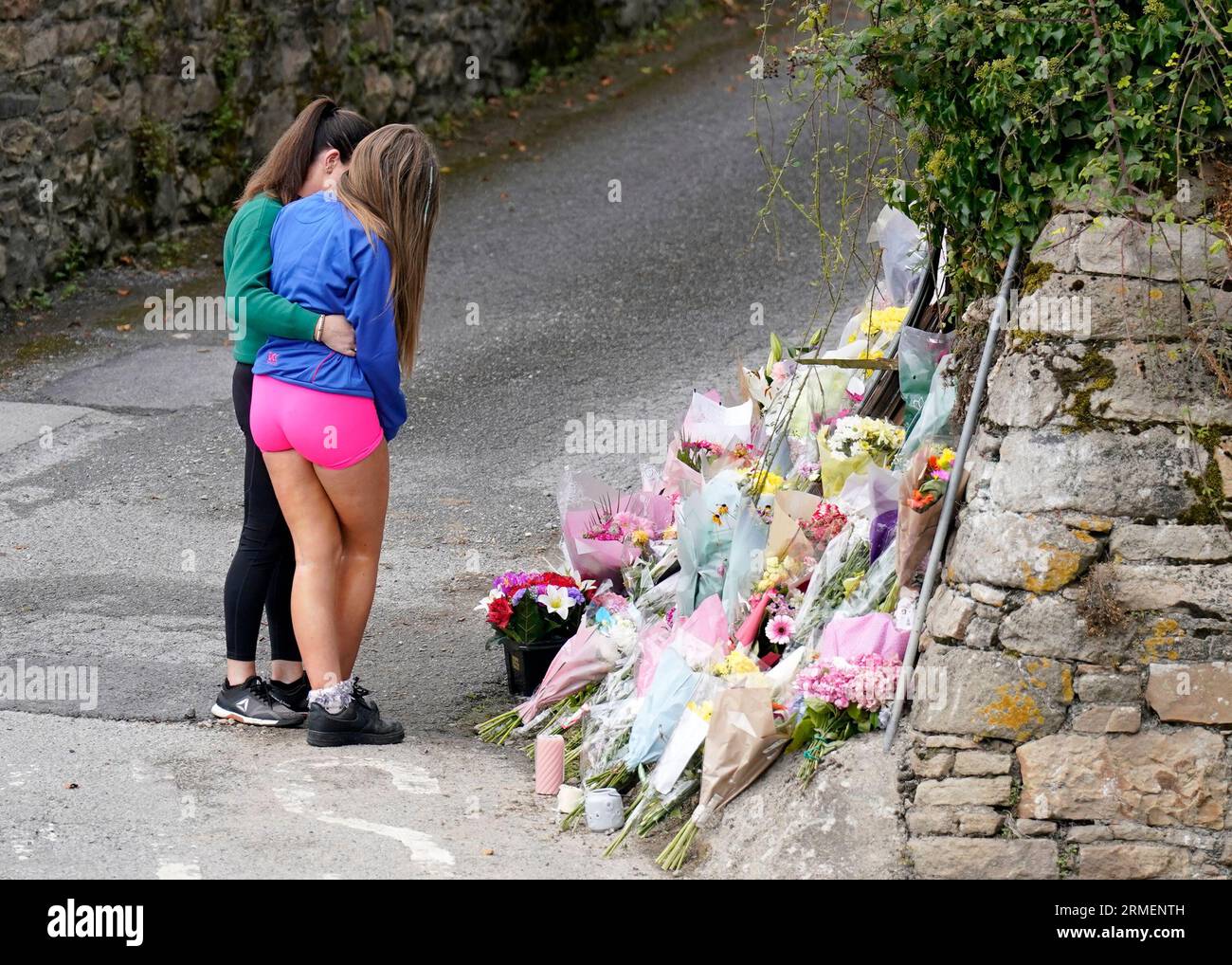 People view tributes at the scene of a crash, in memory of Luke ...