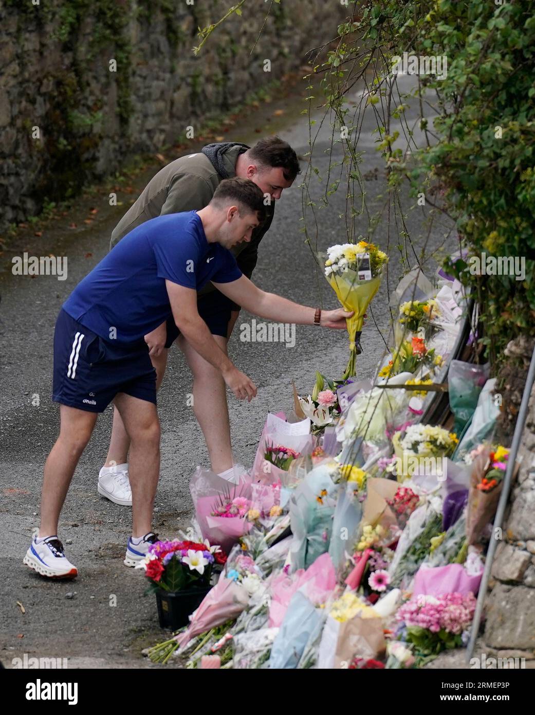 People lay tributes at the scene of a crash, in memory of Luke ...