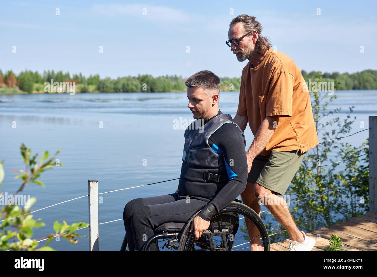 Side view portrait of man with disability ready to scuba dive with ...