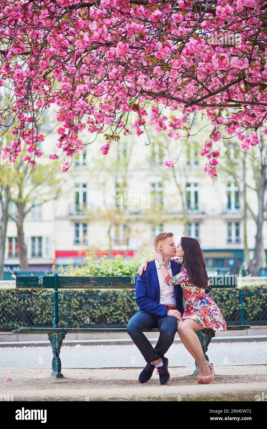 Romantic couple having a date in Paris on a spring day with beautiful ...