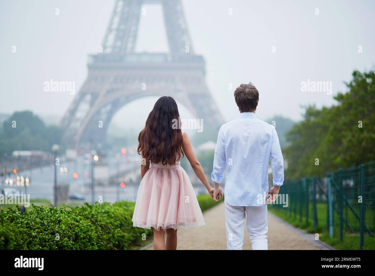 Beautiful romantic couple in love near the Eiffel tower in Paris on a ...