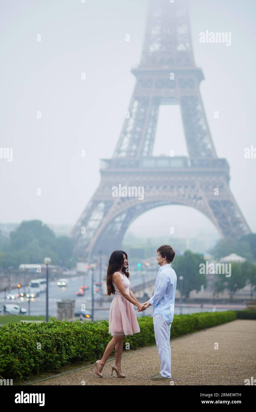 Beautiful romantic couple in love near the Eiffel tower in Paris on a ...