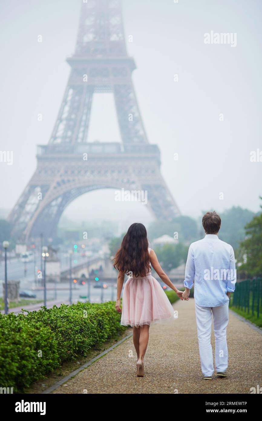 Beautiful romantic couple in love near the Eiffel tower in Paris on a ...