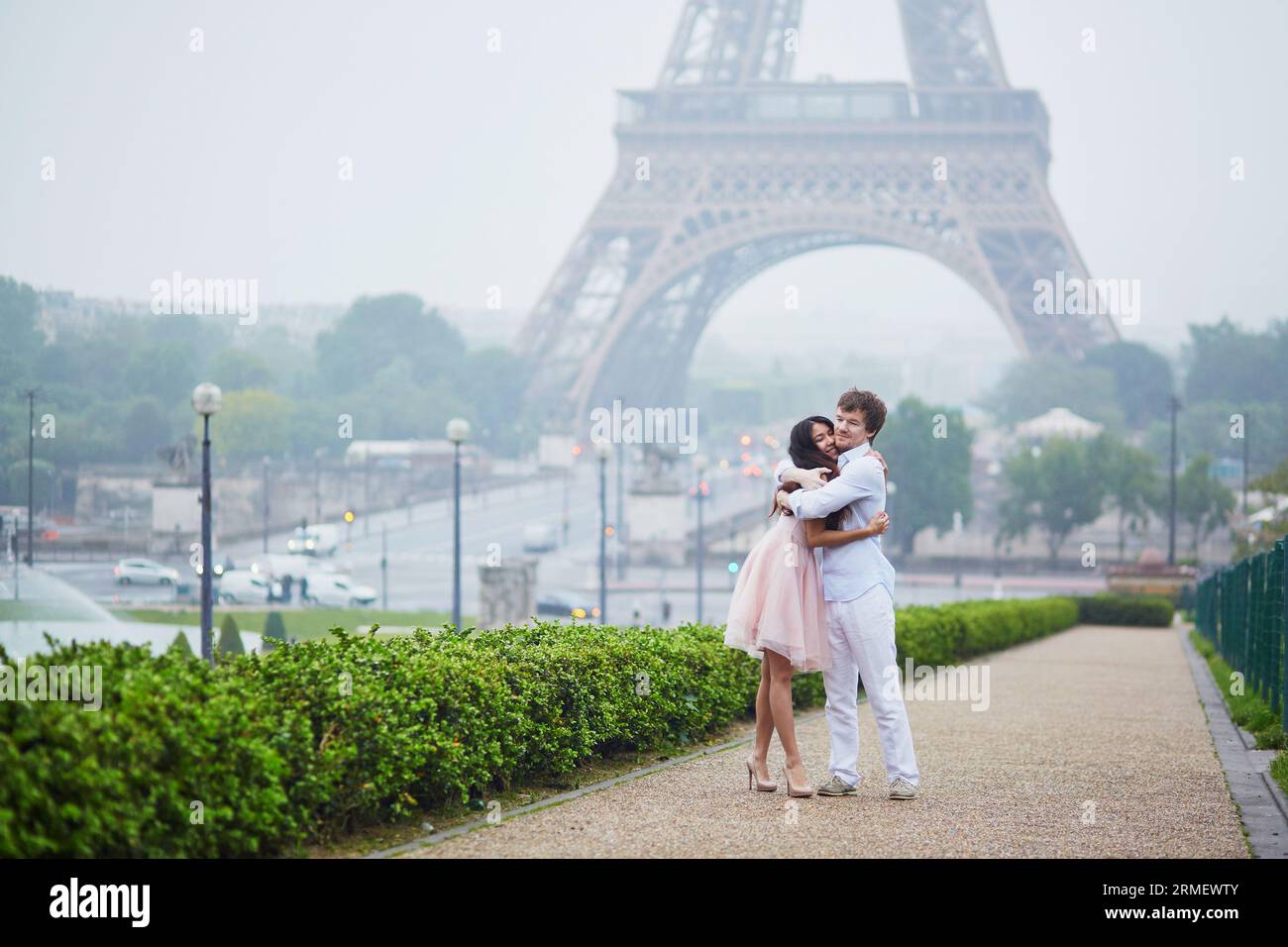 Beautiful romantic couple in love near the Eiffel tower in Paris on a ...