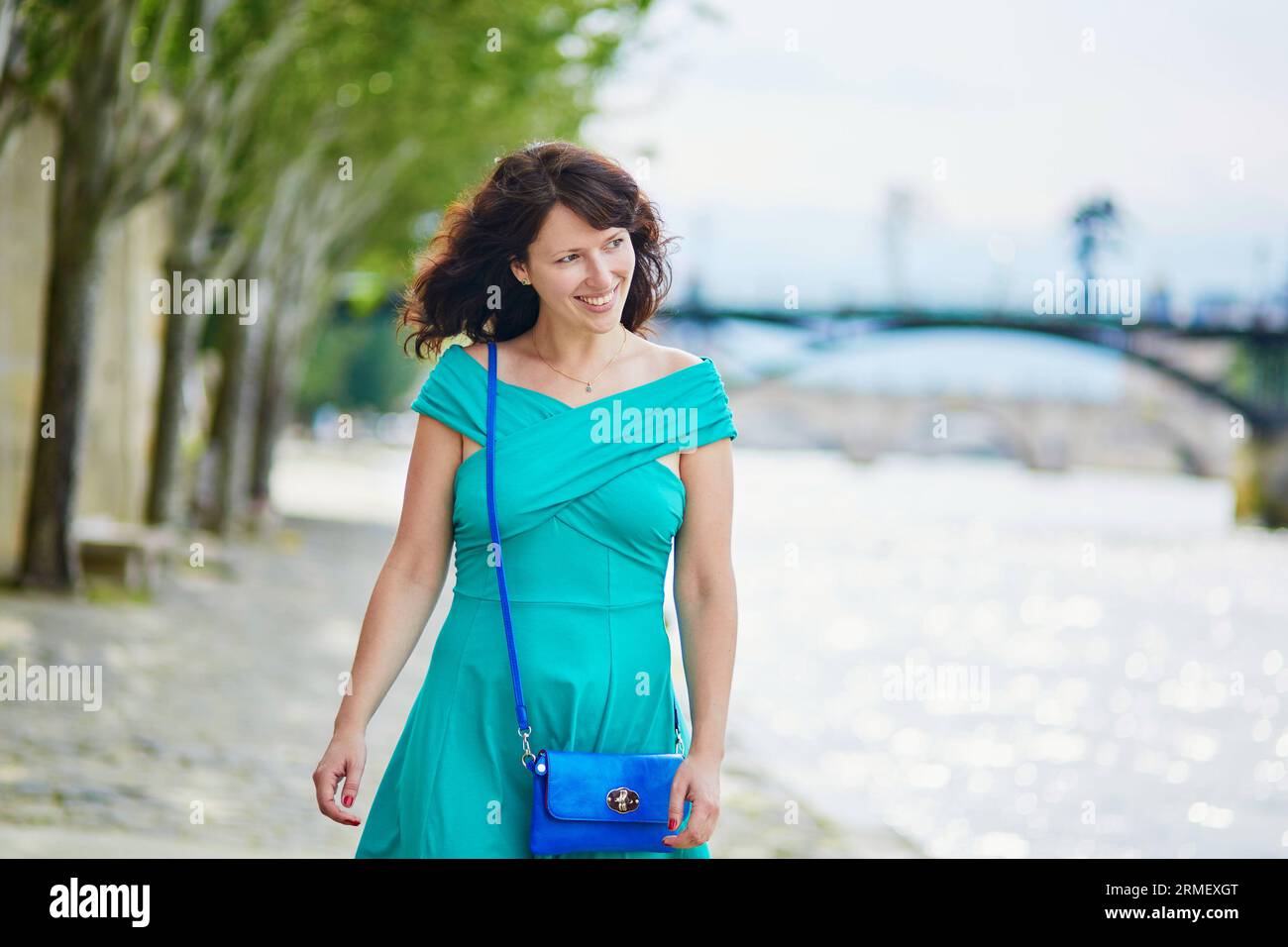 Young woman walking near the Seine in Paris, France Stock Photo - Alamy