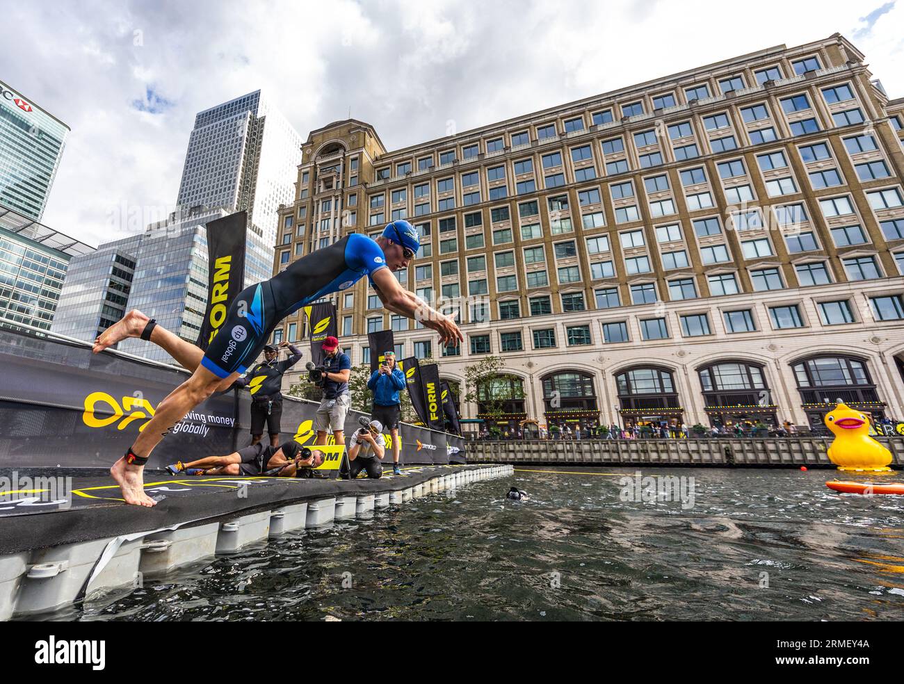 Max Stapley jumps into the water as he competes the men's race during ...