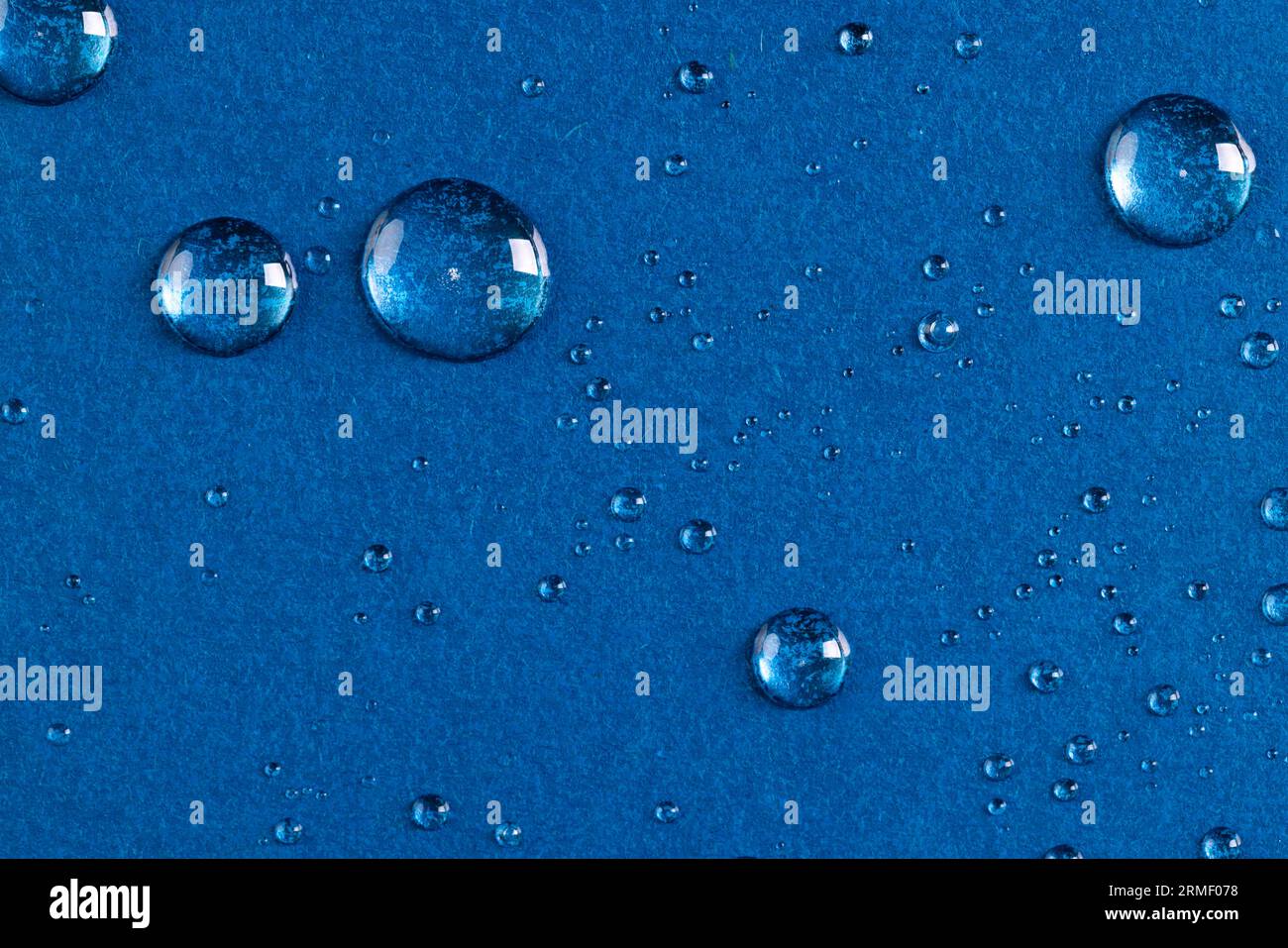Micro close up of water drops with copy space on blue background Stock ...